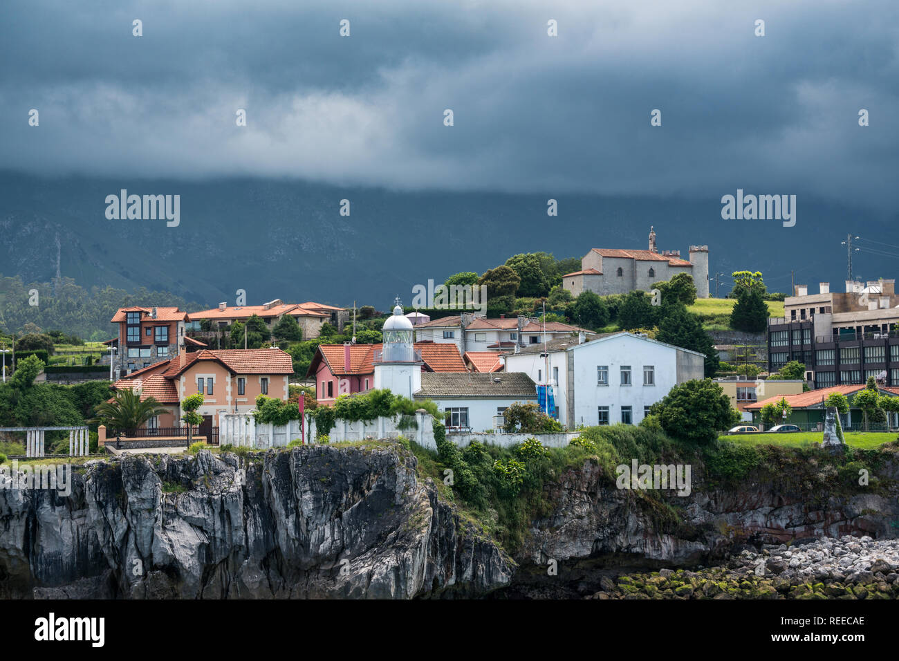 View of Llanes (Asturias, Spain) with lighthouse and Ermita Virgen de ...