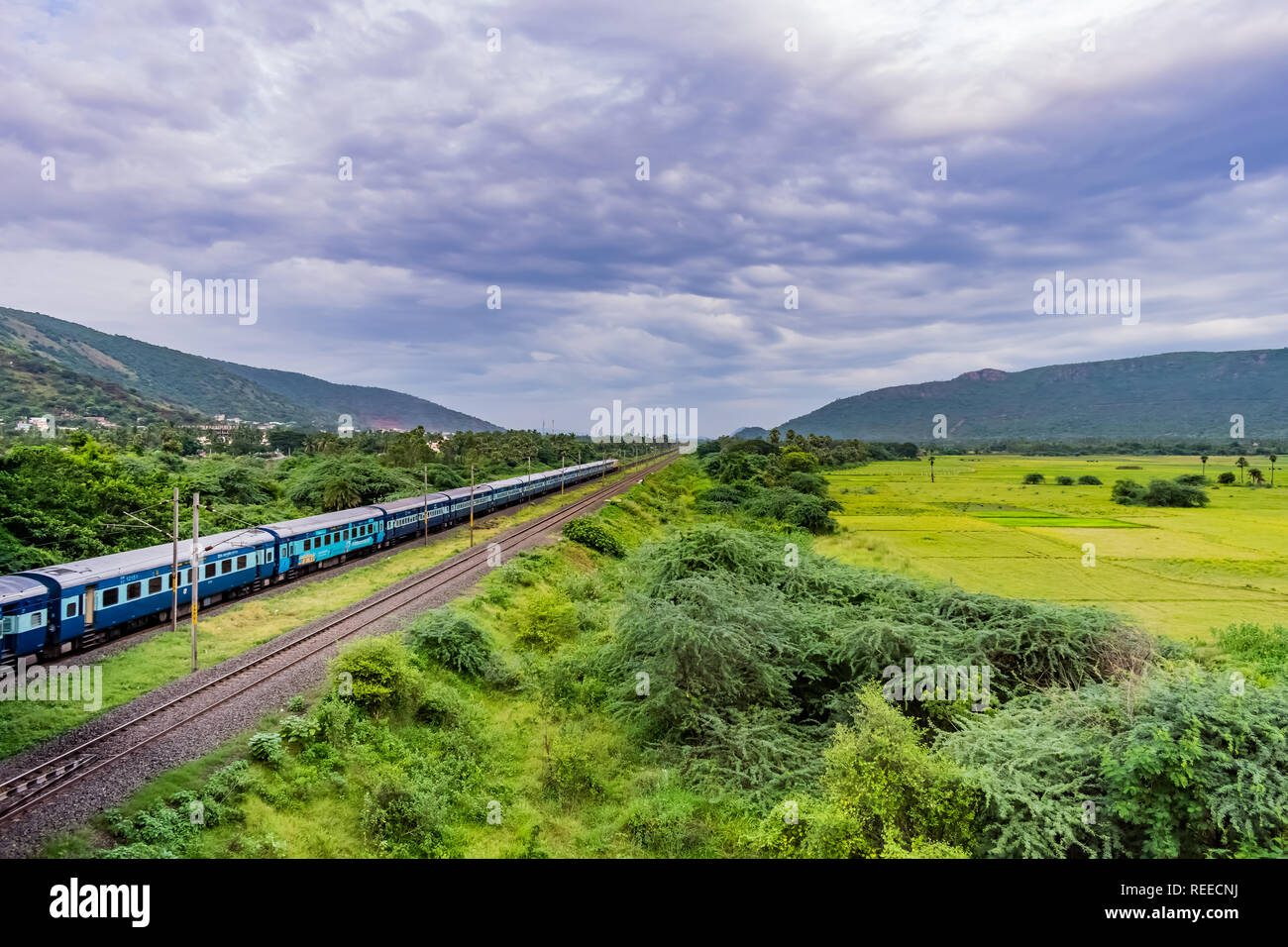 awesome view of Indian railway running on track goes to horizon in ...