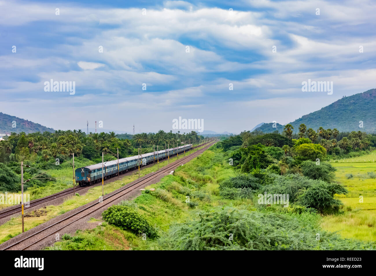 awesome view of Indian railway running on track goes to horizon in ...