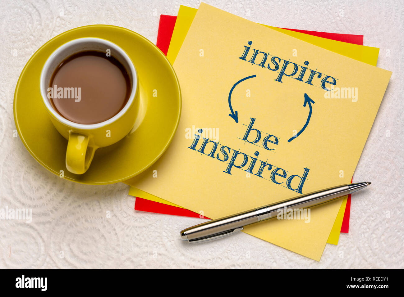 inspire and be inspired concept - handwriting on a square reminder note ...