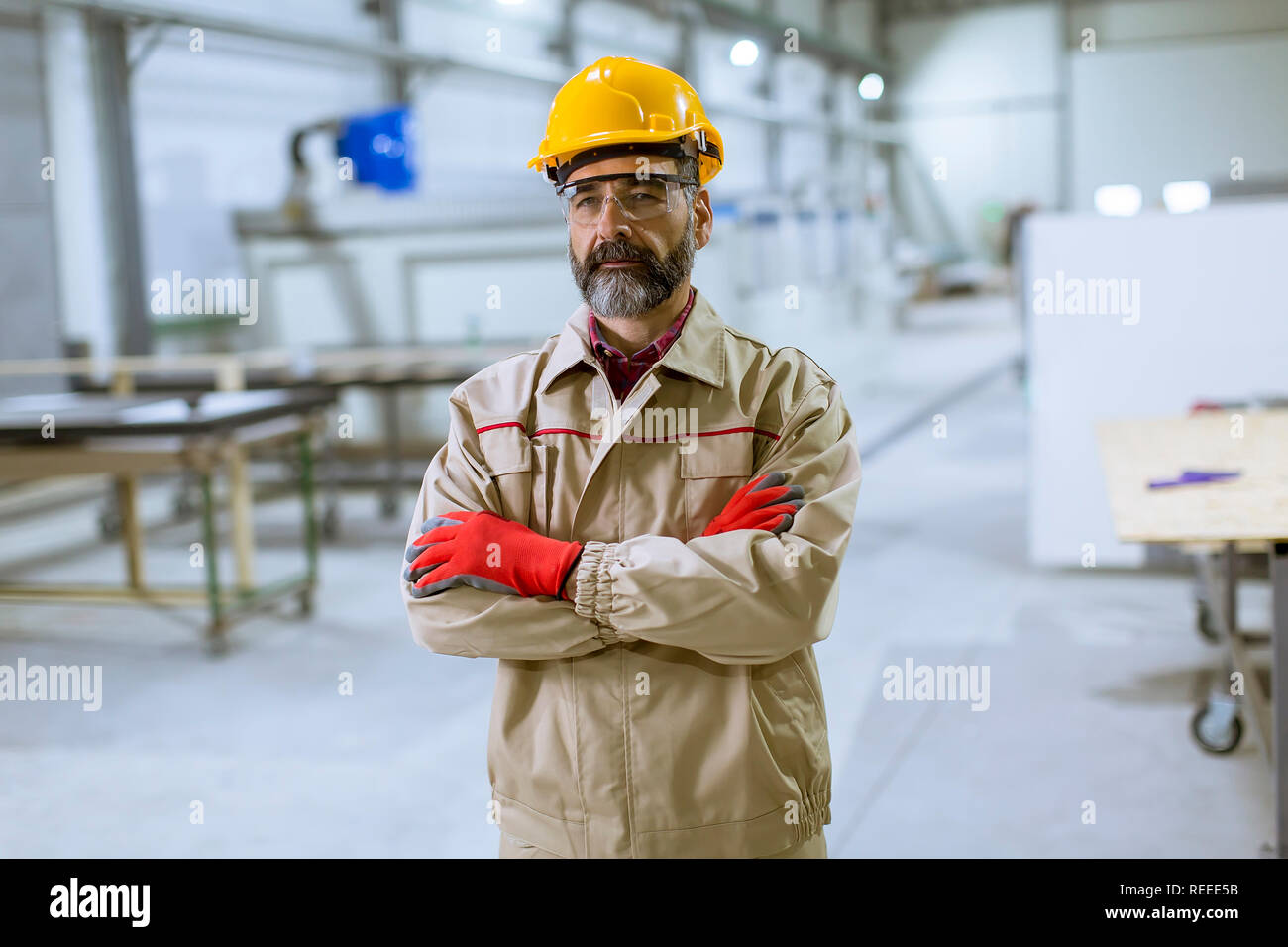 Portrait of a handsome middle-aged engineer in factory Stock Photo - Alamy