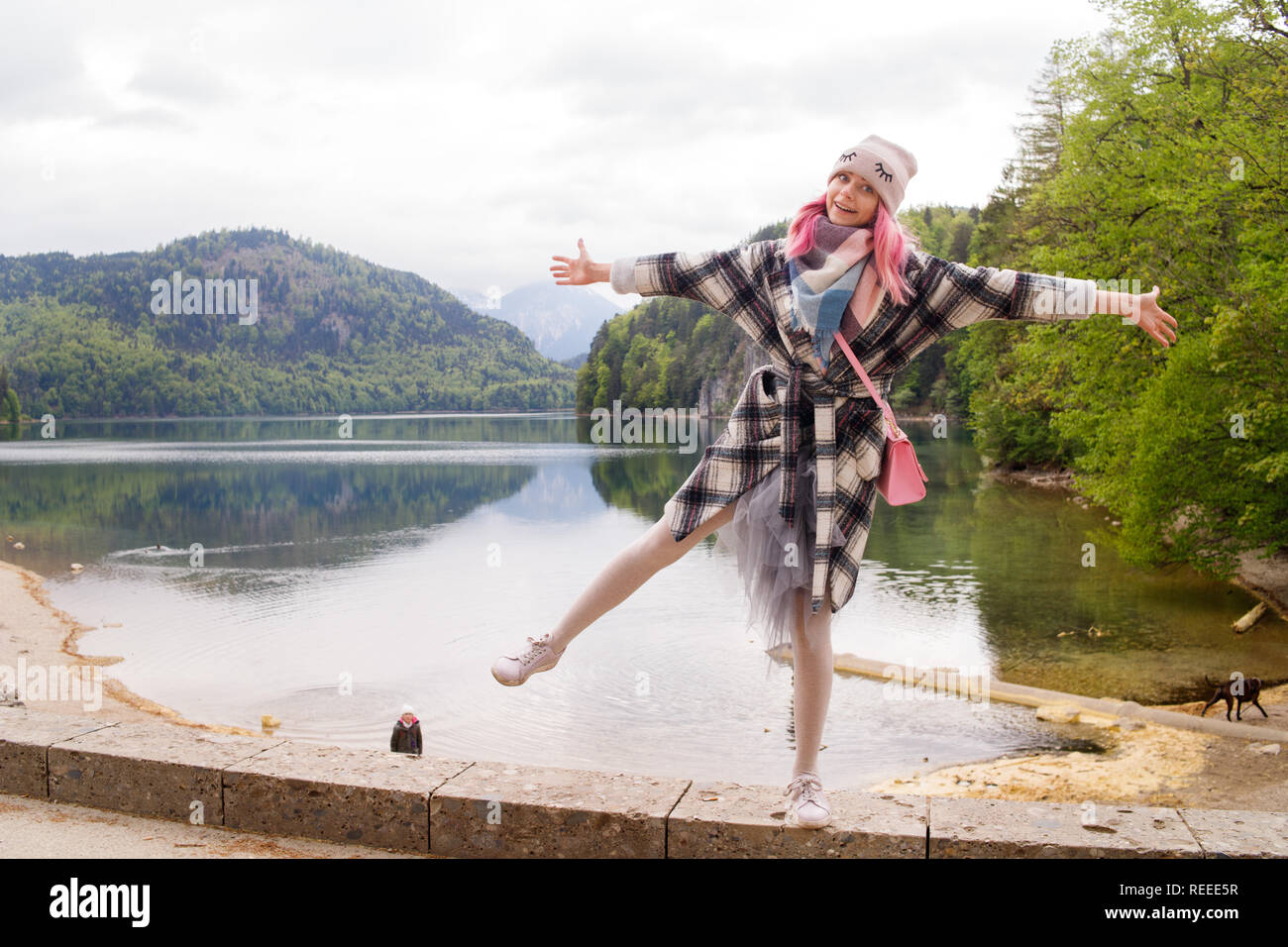 girl near the lake Neuschwanstein castle Stock Photo - Alamy