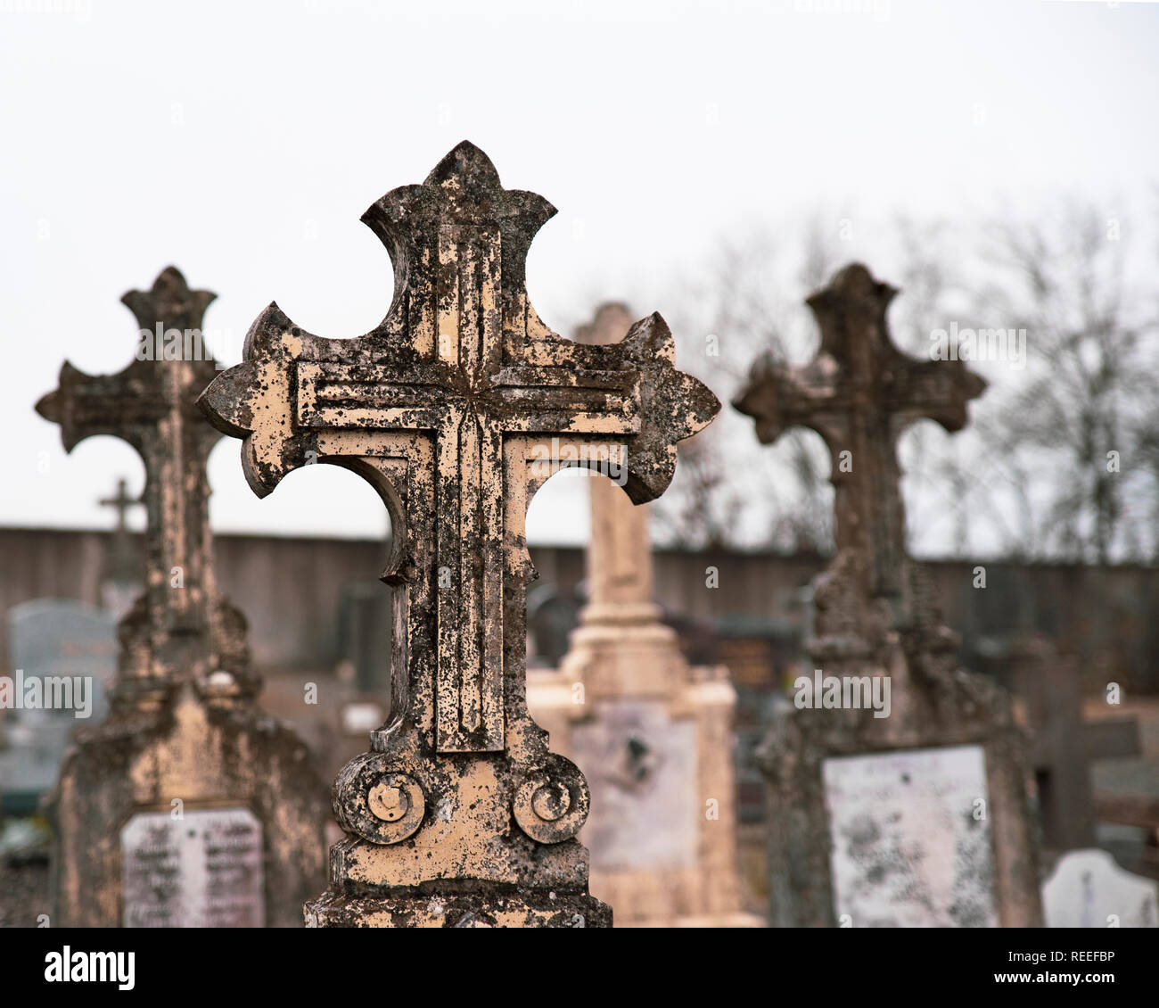 Ancient cross on tombs in a cemetery Stock Photo - Alamy