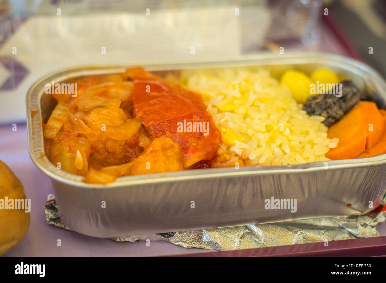 inflight airline meal economy class Sweet and Sour Fish and Fried Rice ...