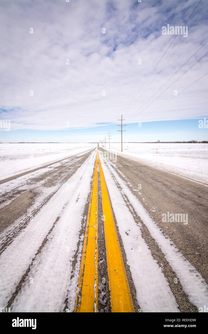 dangerous ice covered country road in Illinois in sub zero weather ...