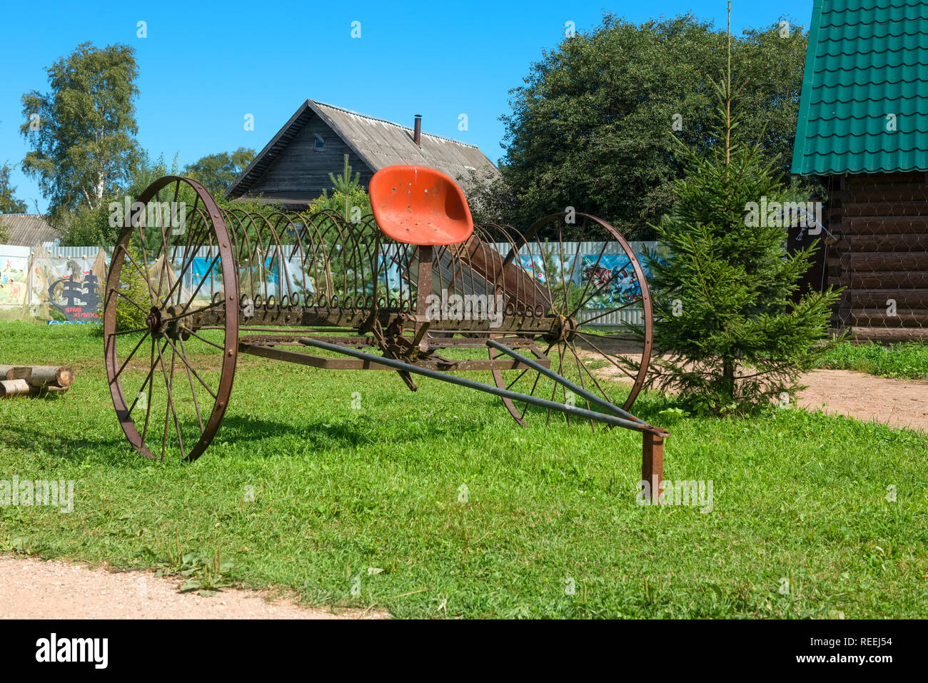 Old farm equipment on the farm. Trailer rake Stock Photo - Alamy
