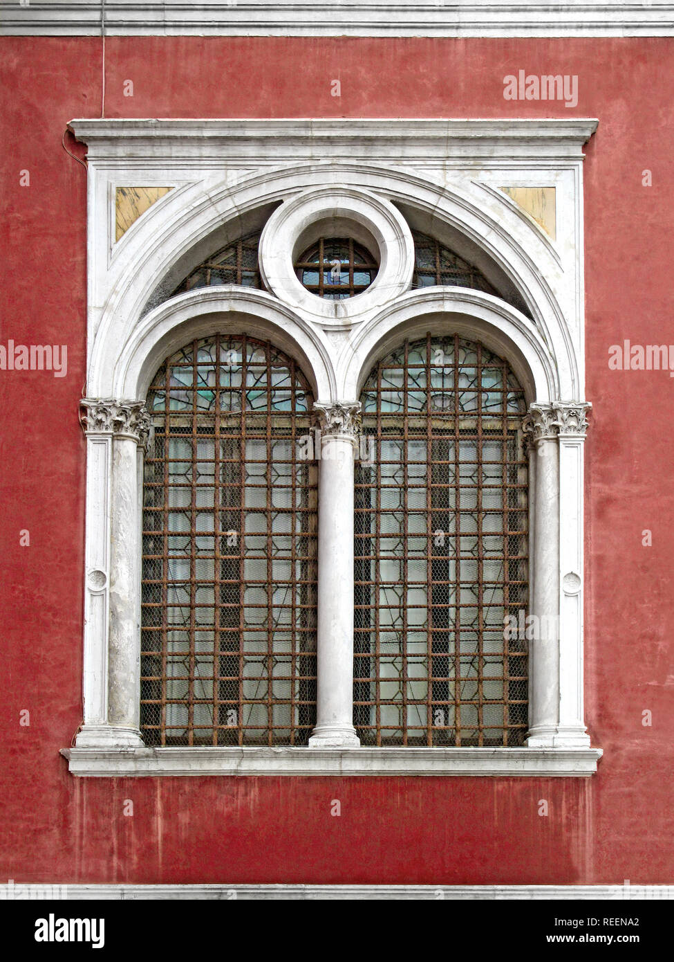 ancient marble stone decorated window on church facade in Venice Stock ...