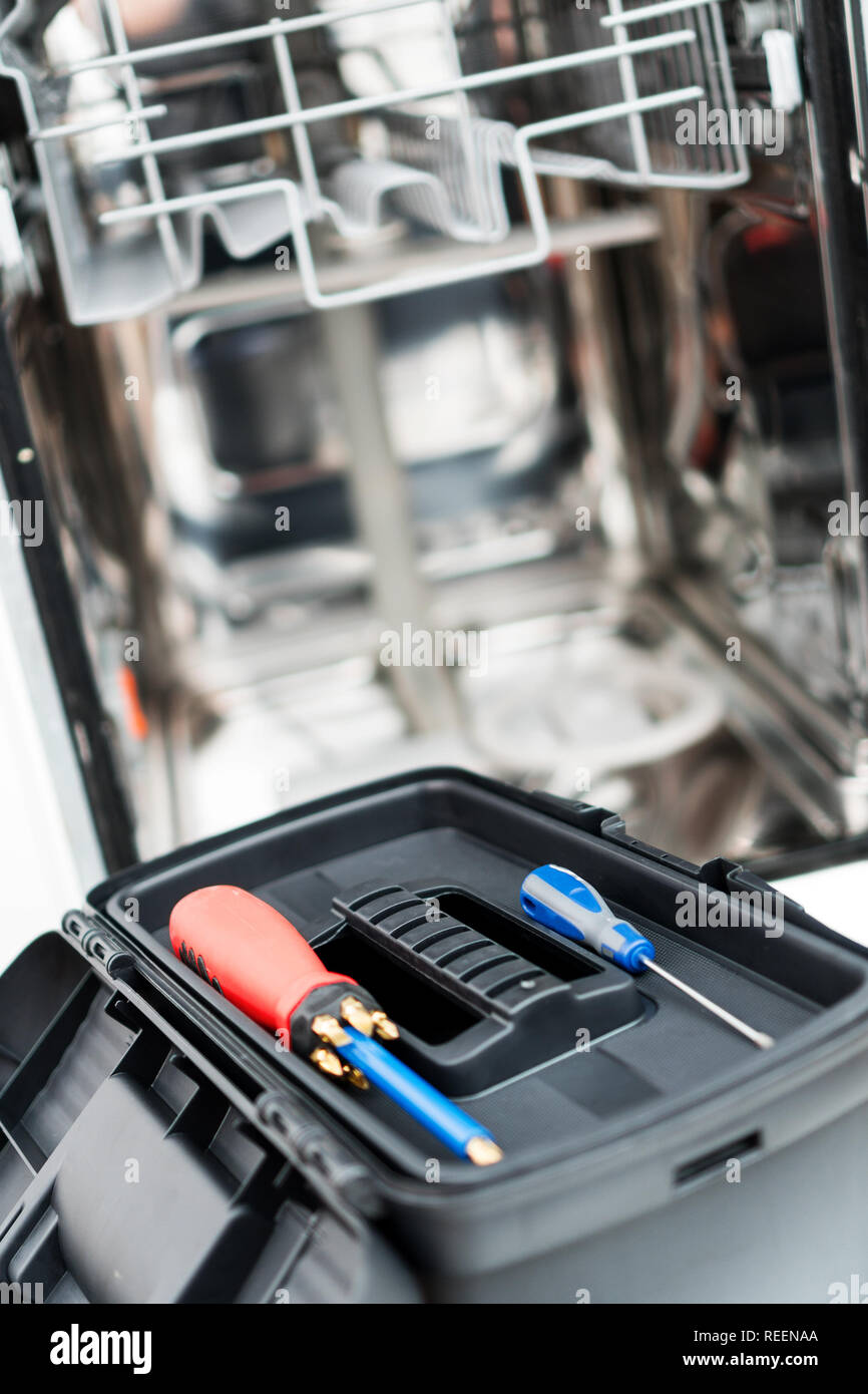 Toolbox in front of domestic dishwasher in the kitchen Stock Photo - Alamy