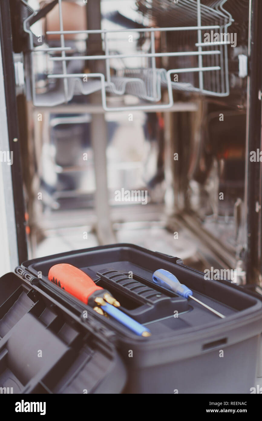 Toolbox in front of domestic dishwasher in the kitchen Stock Photo - Alamy