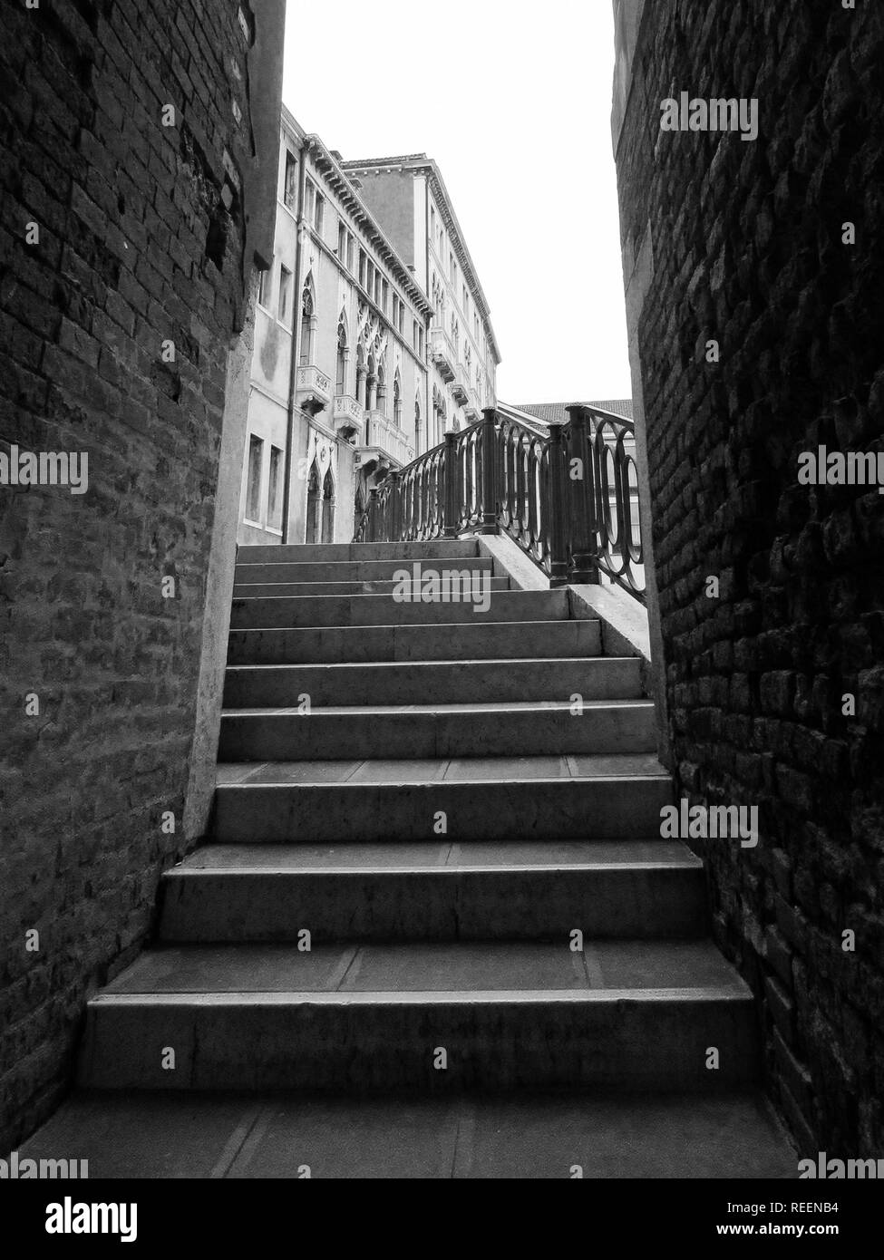 marble stone staircase with bridge between brick walls in Venice Stock ...