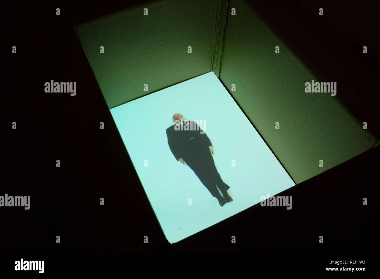 An art video installation in carton box entitled "Lenin Turning in his ...