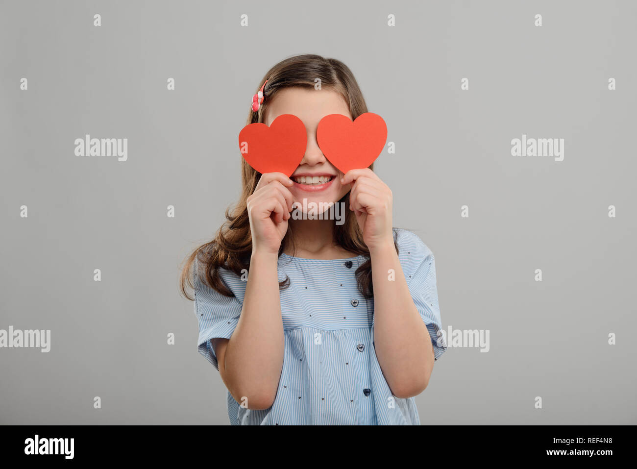 Girl with red heart eyes Stock Photo - Alamy
