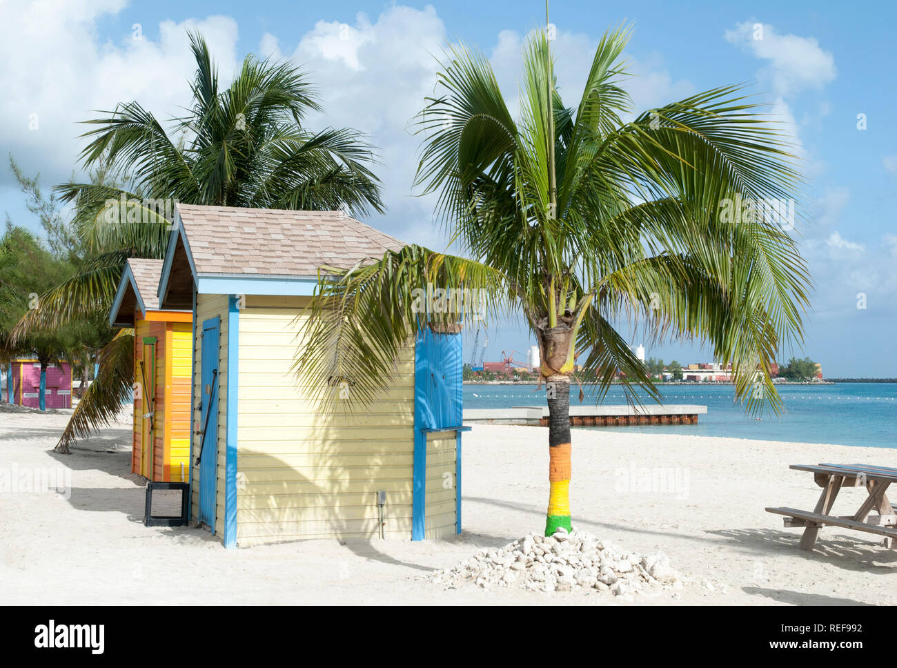 Little palm trees and colorful vending booths on Nassau city beach ...