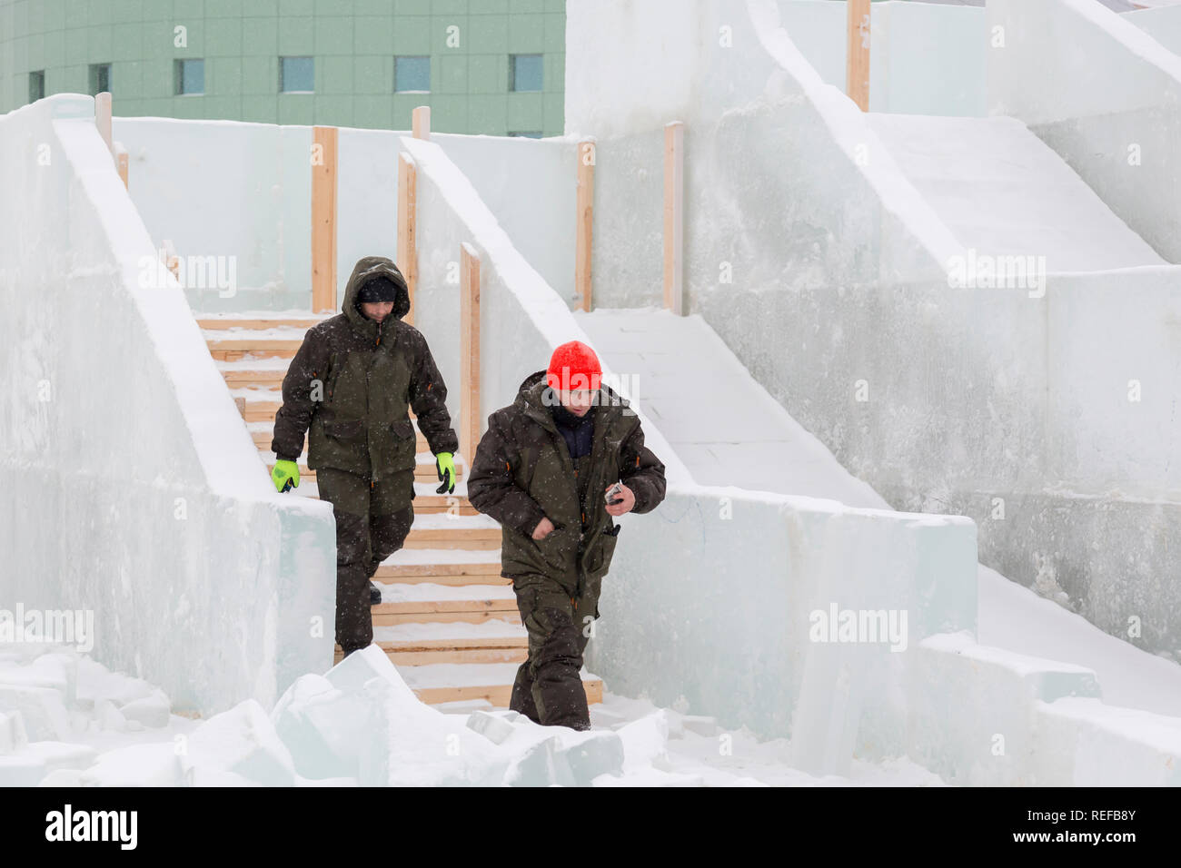 Workers at the construction site of the ice town at work Stock Photo ...