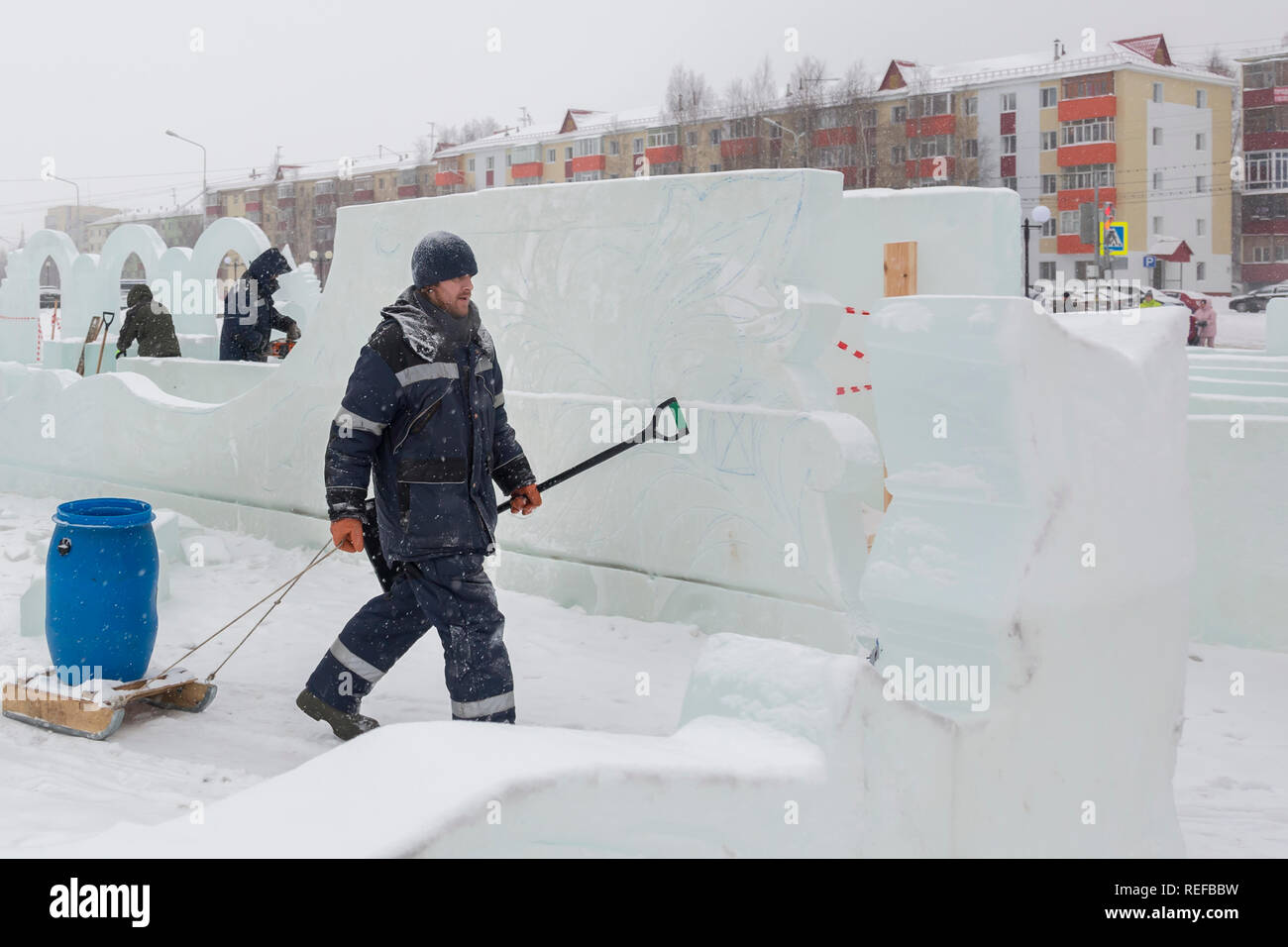 A man carries on a sled a barrel of water on the ice town Stock Photo ...
