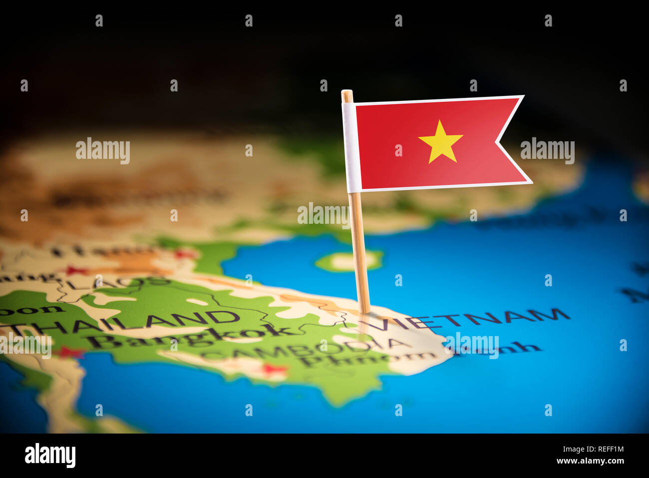 Vietnam marked with a flag on the map Stock Photo - Alamy