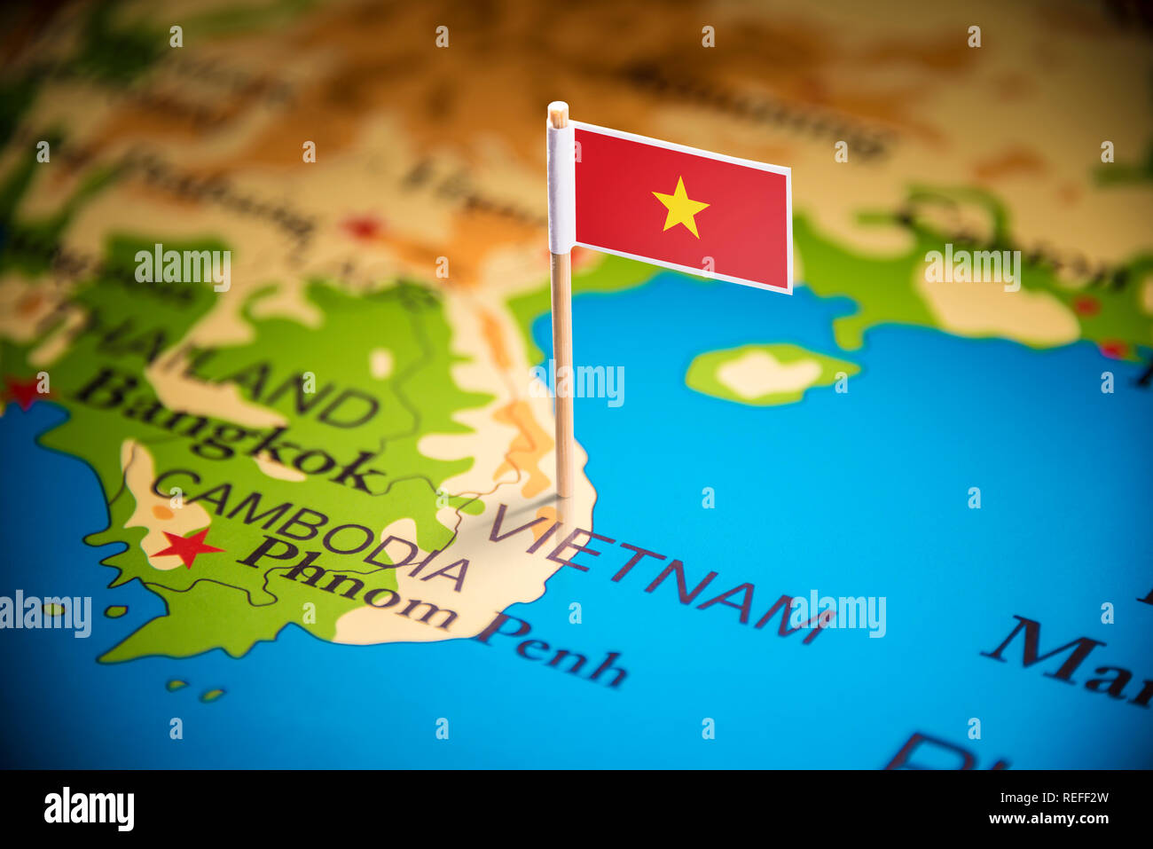 Vietnam marked with a flag on the map Stock Photo - Alamy