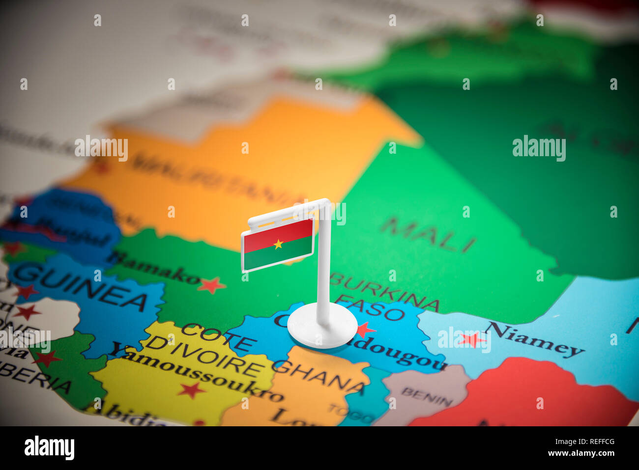 Burkina Faso marked with a flag on the map Stock Photo - Alamy