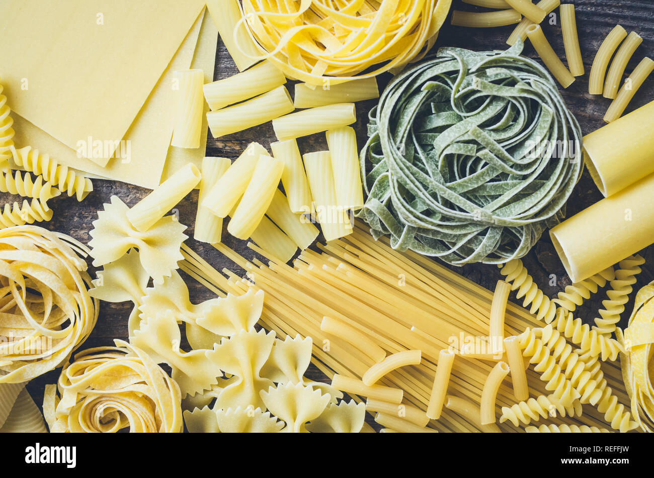 Background texture from variety of types and shapes of Italian pasta on ...