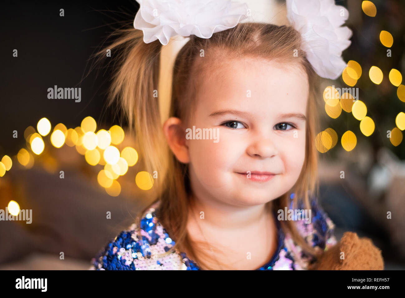 Close up portrait of a young girl with a bows on her hair Stock Photo ...