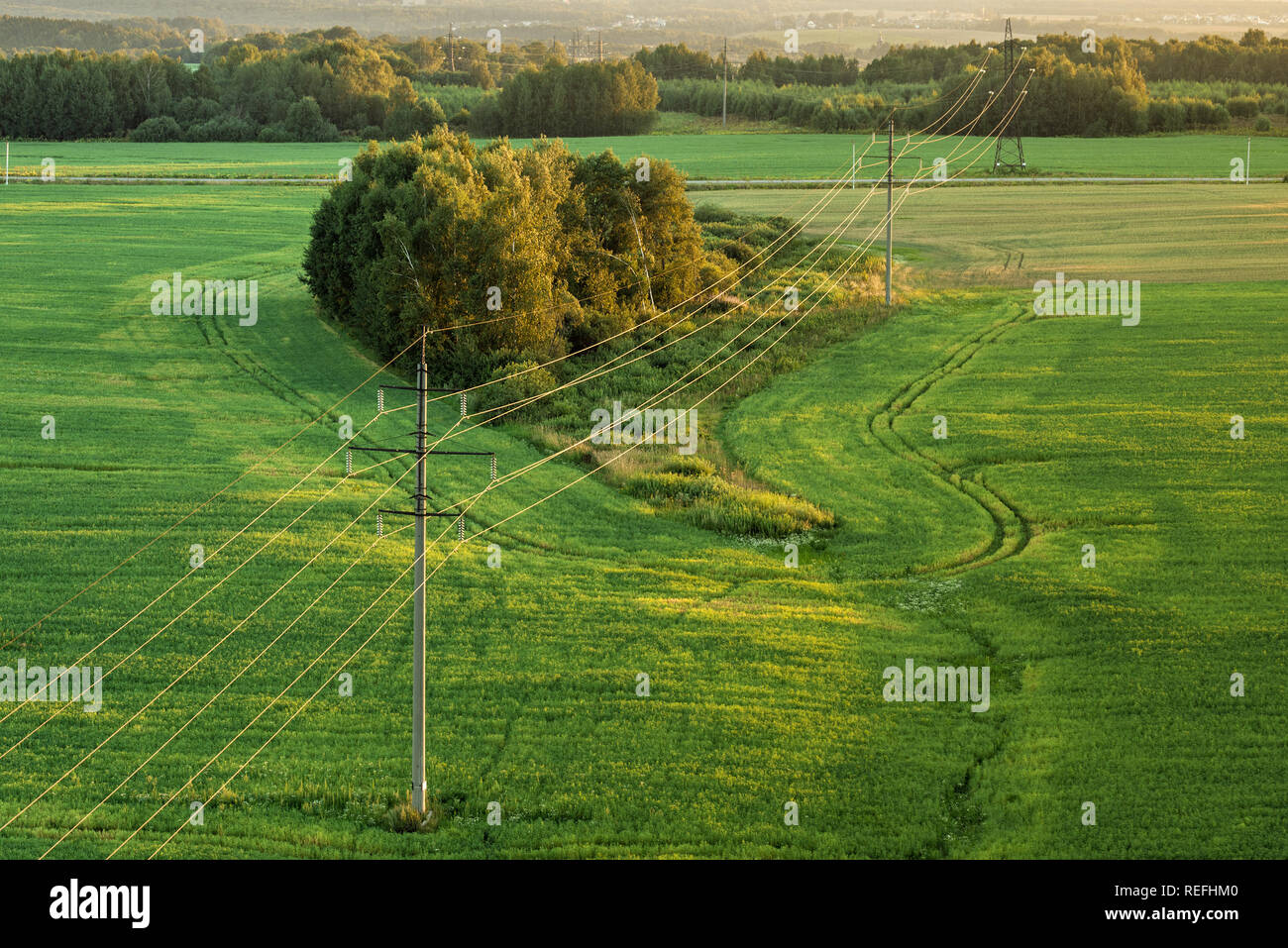 Transmission of electricity on the ground. Power lines in the field ...