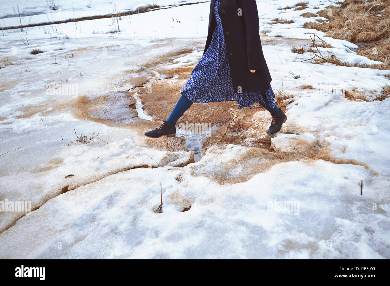 Jumping over puddle hi-res stock photography and images - Alamy