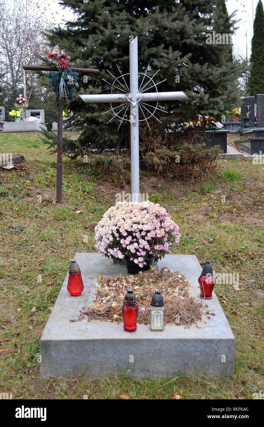 Old cross at the cemetery and a grave Stock Photo - Alamy