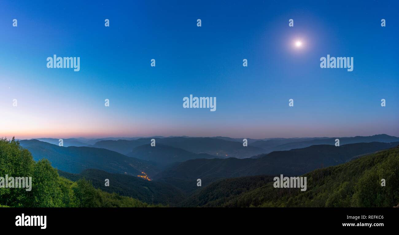 Sunrise in Rodopa mountain with full moon on sky Stock Photo - Alamy