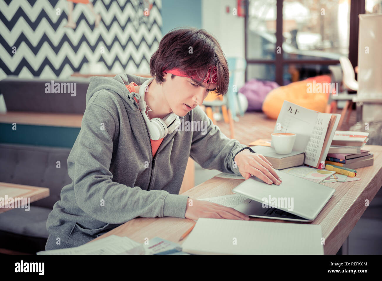 Student finishing working on his course paper Stock Photo - Alamy