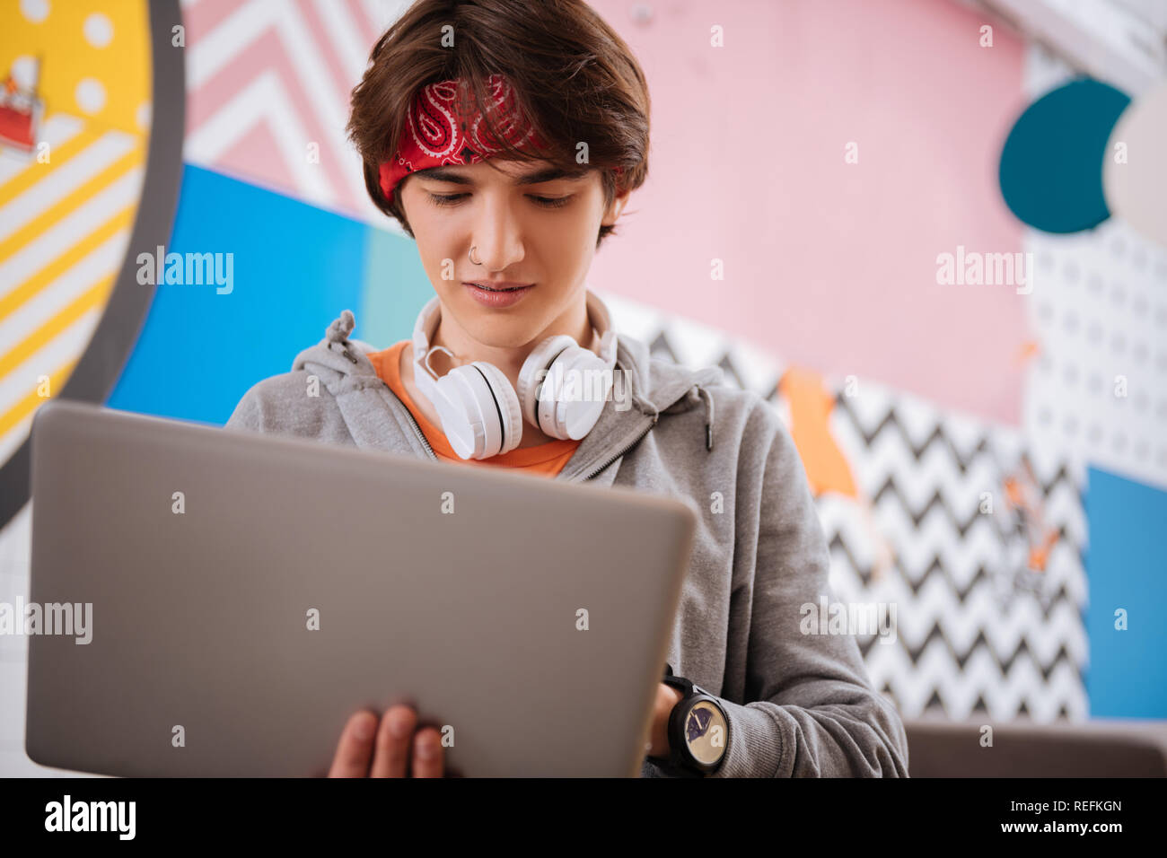 junior QA specialist working with his laptop Stock Photo - Alamy