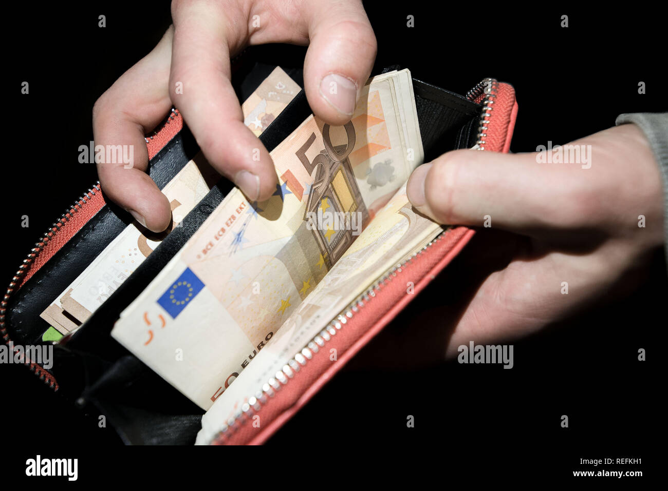 Man holding wallet full of euro money bills and banknotes. Concept of ...