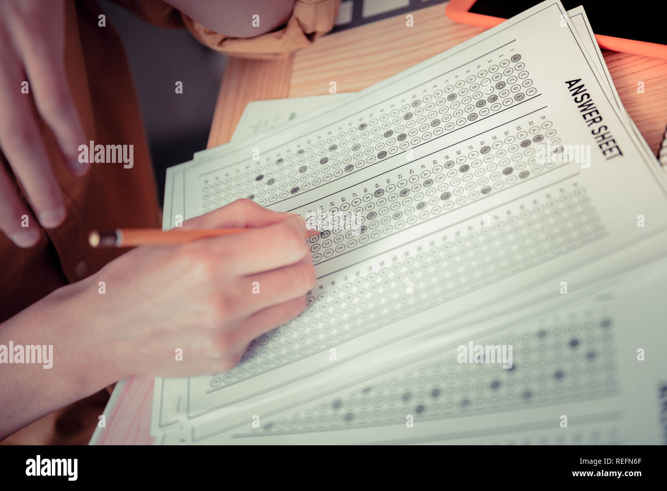 Student having a big test with closed-coded answers Stock Photo - Alamy