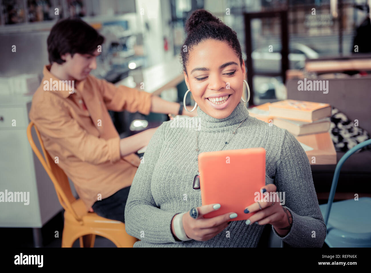 Girl communicating online with her friends and classmates Stock Photo ...