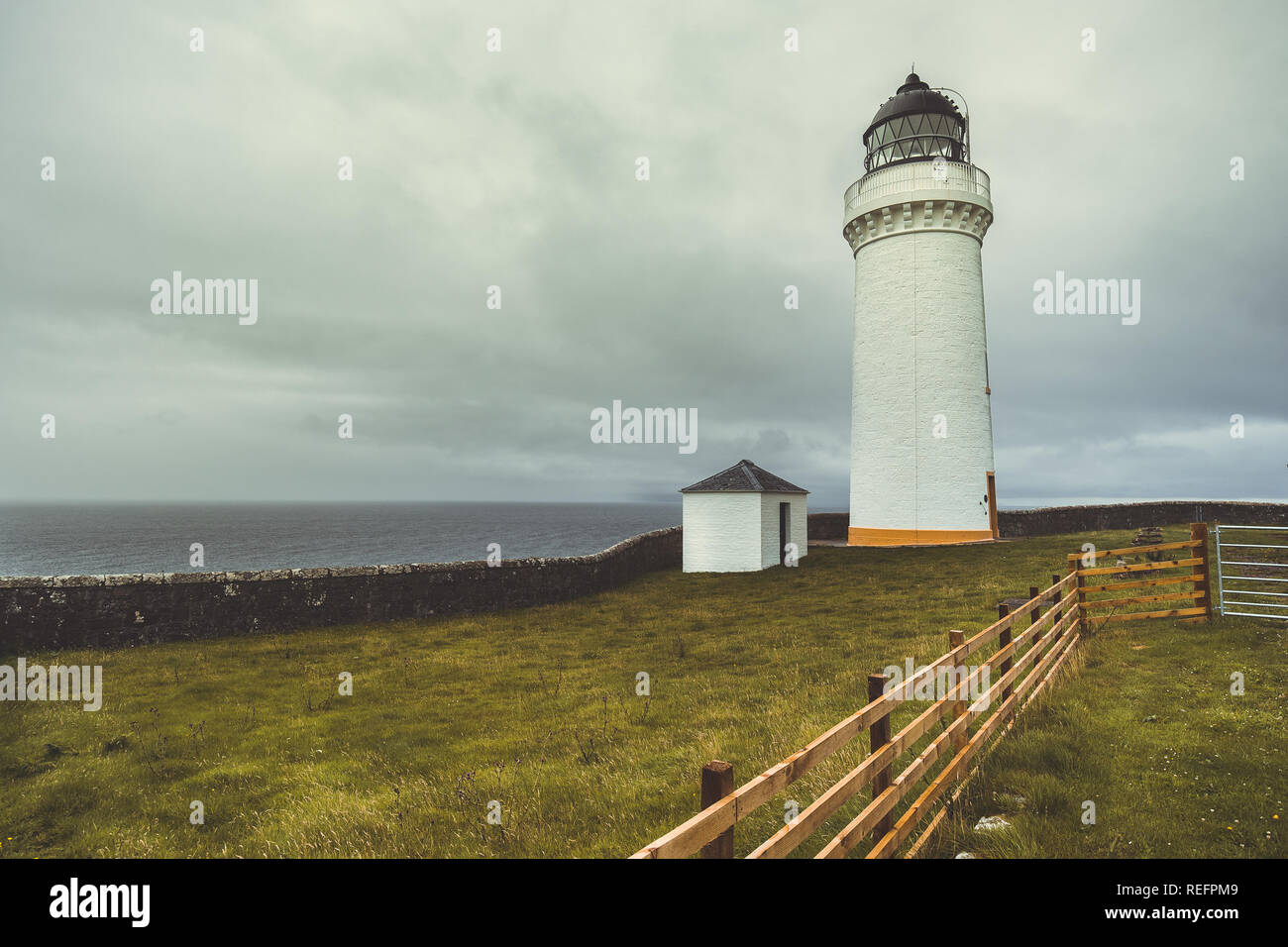 Close-up white Campbeltown lighthouse. Northern Ireland. The cloudy ...