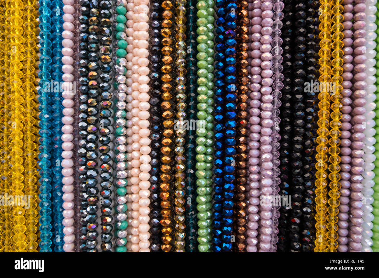 Wallpaper background of colorful necklace made of gemstones and colored ...