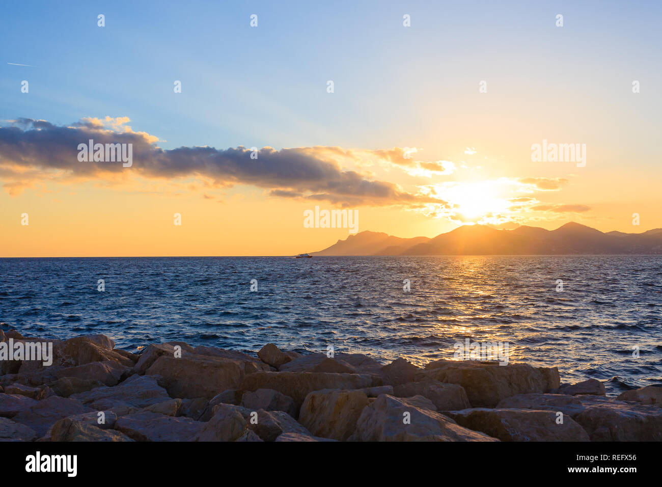 Sunset from the port of Cannes, France. Beautiful french panorama. Sun ...
