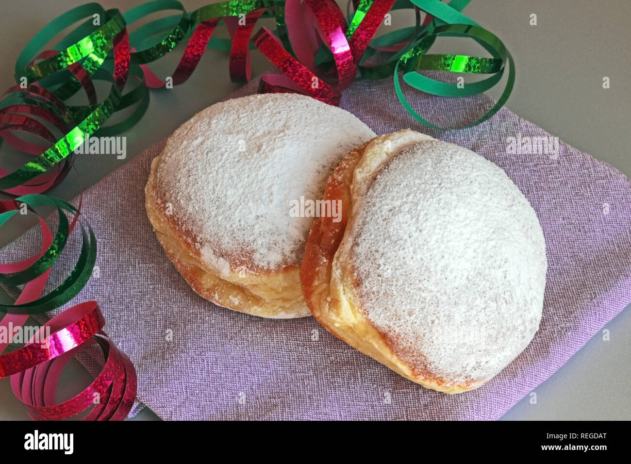 traditional carnival pastry: Berlin doughnuts decorated with streamers ...