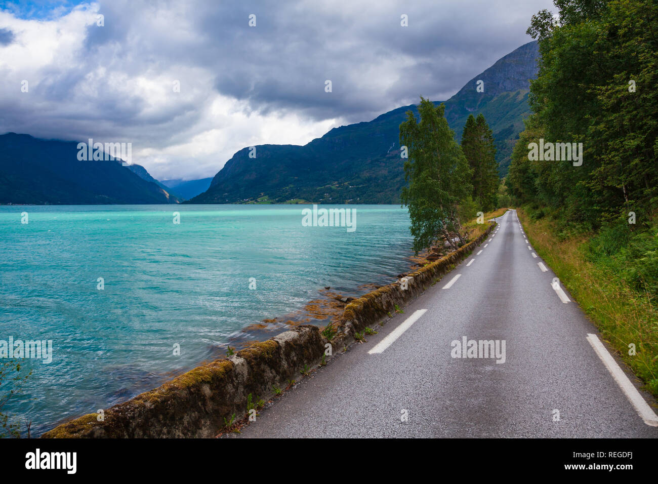 Scenic road along the Lustrafjord or Lustrafjorden fjord, branch of ...