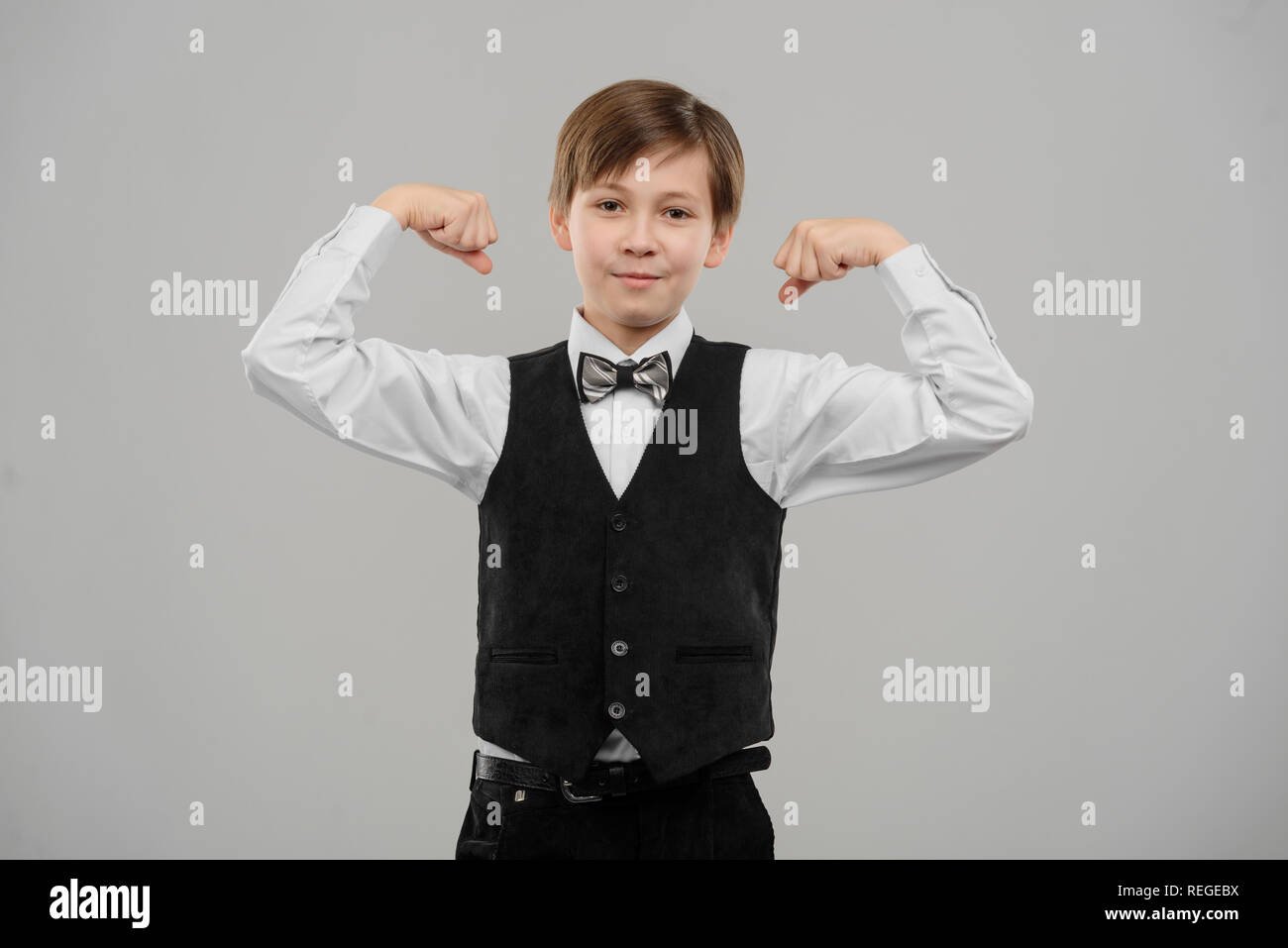 Little boy bragging about biceps Stock Photo - Alamy