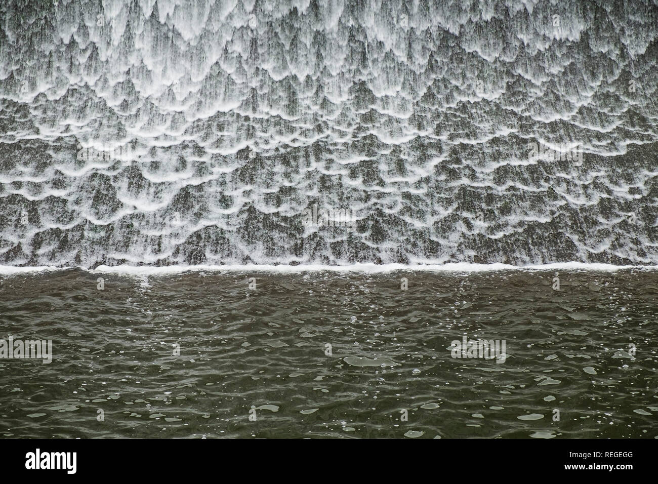 Water flowing down the spillway at Porth Reservoir in Cornwall Stock ...