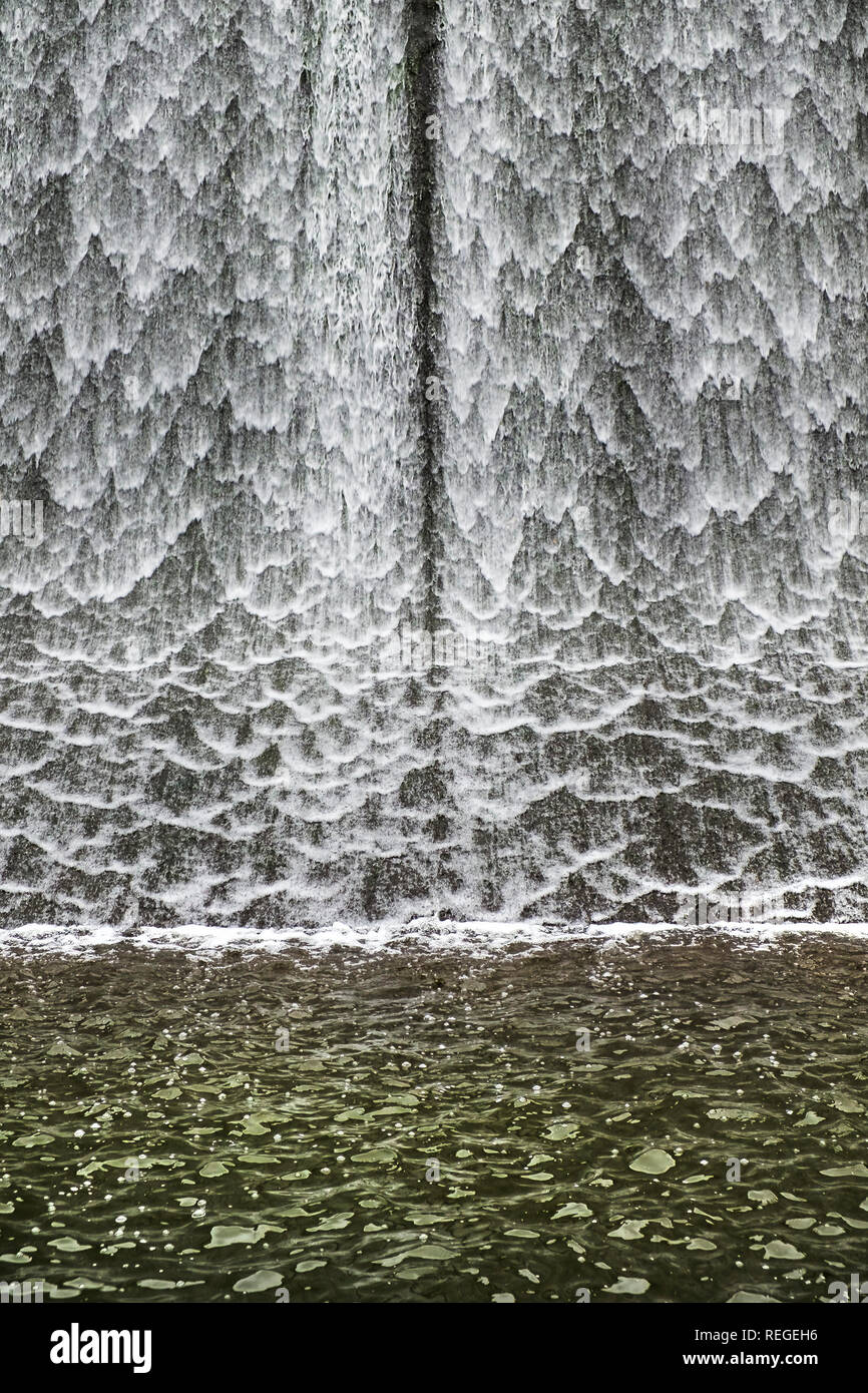 Water flowing down the spillway at Porth Reservoir in Cornwall Stock ...