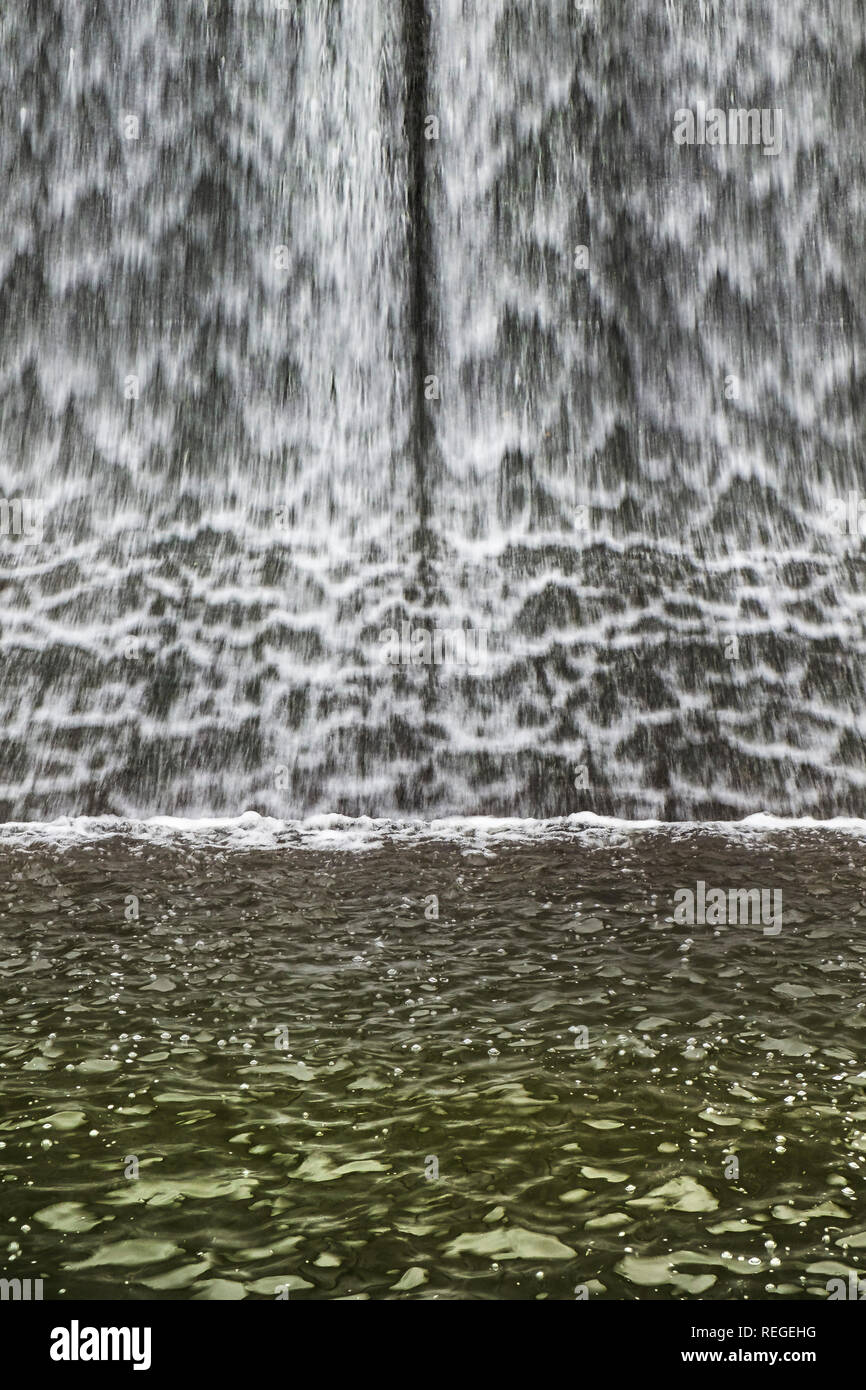 Water flowing down the spillway at Porth Reservoir in Cornwall Stock ...