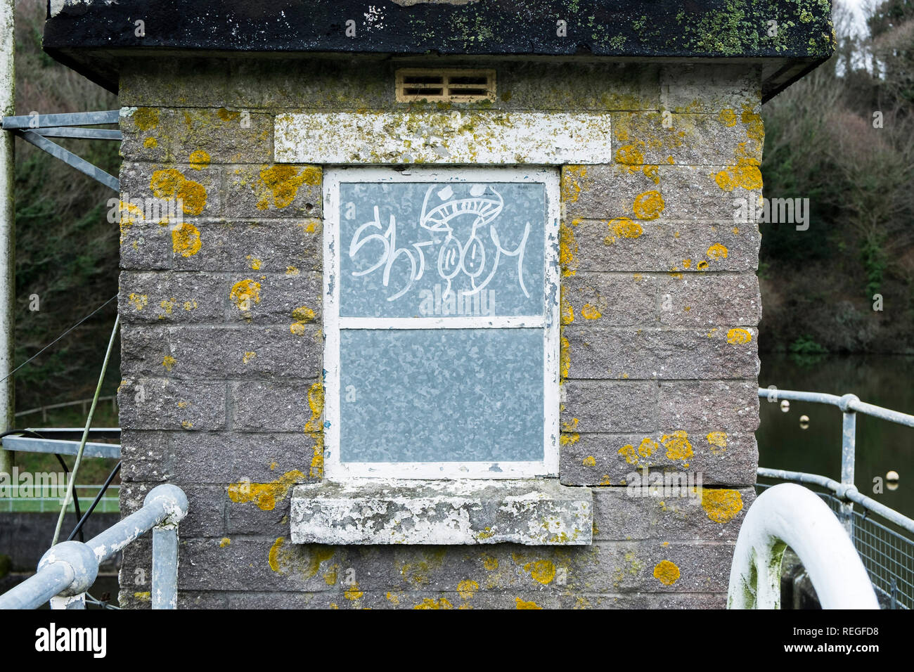 Graffiti written on a boarded up window of a building at Porth ...