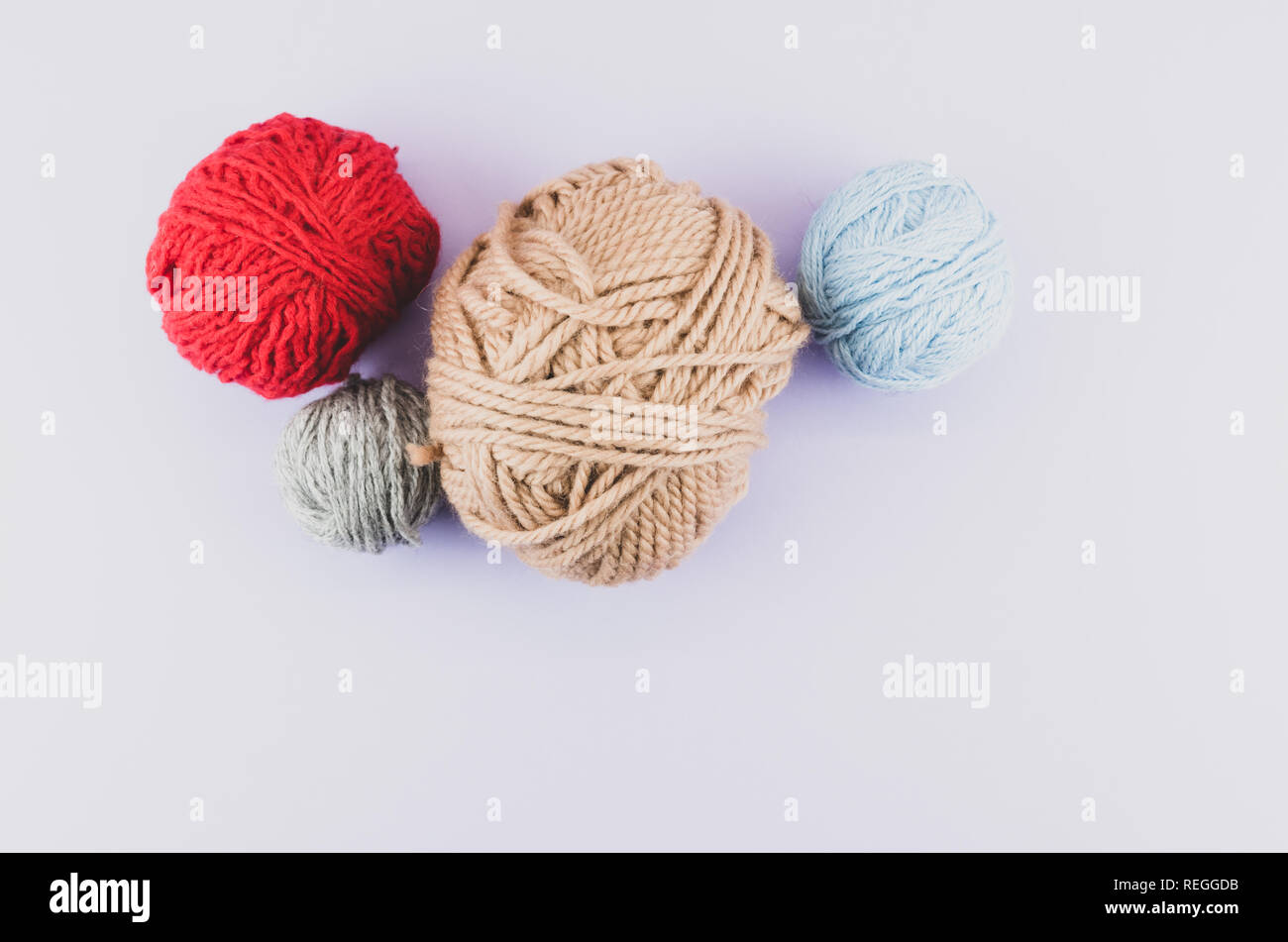 wooll balls still life on a white surface Stock Photo - Alamy