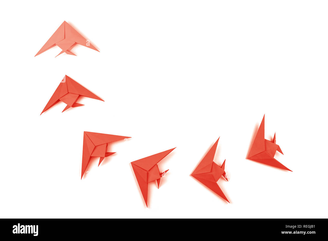 Coral origami fishes isolated on white background Stock Photo - Alamy