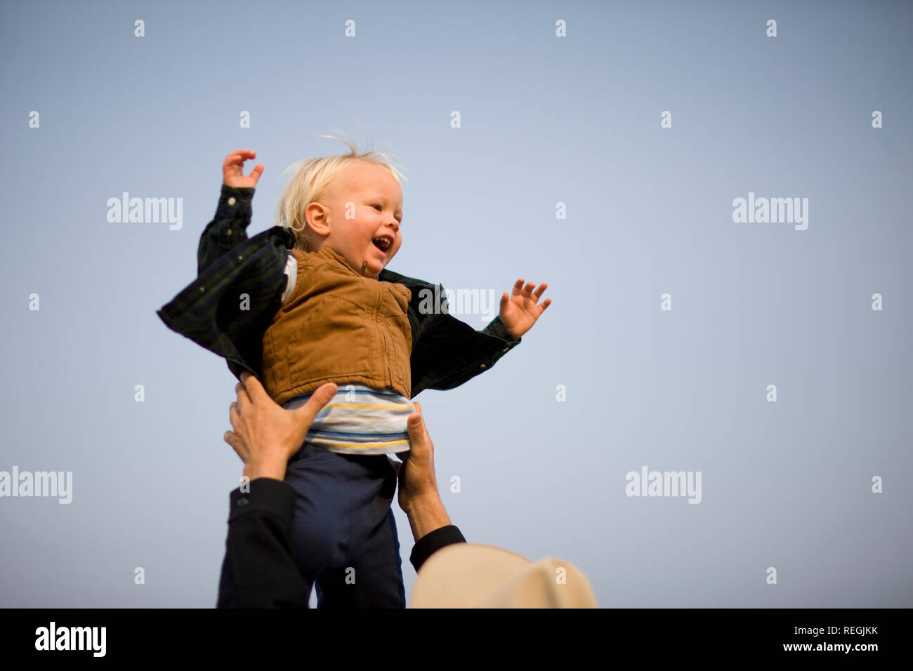 Child being lifted hi-res stock photography and images - Alamy
