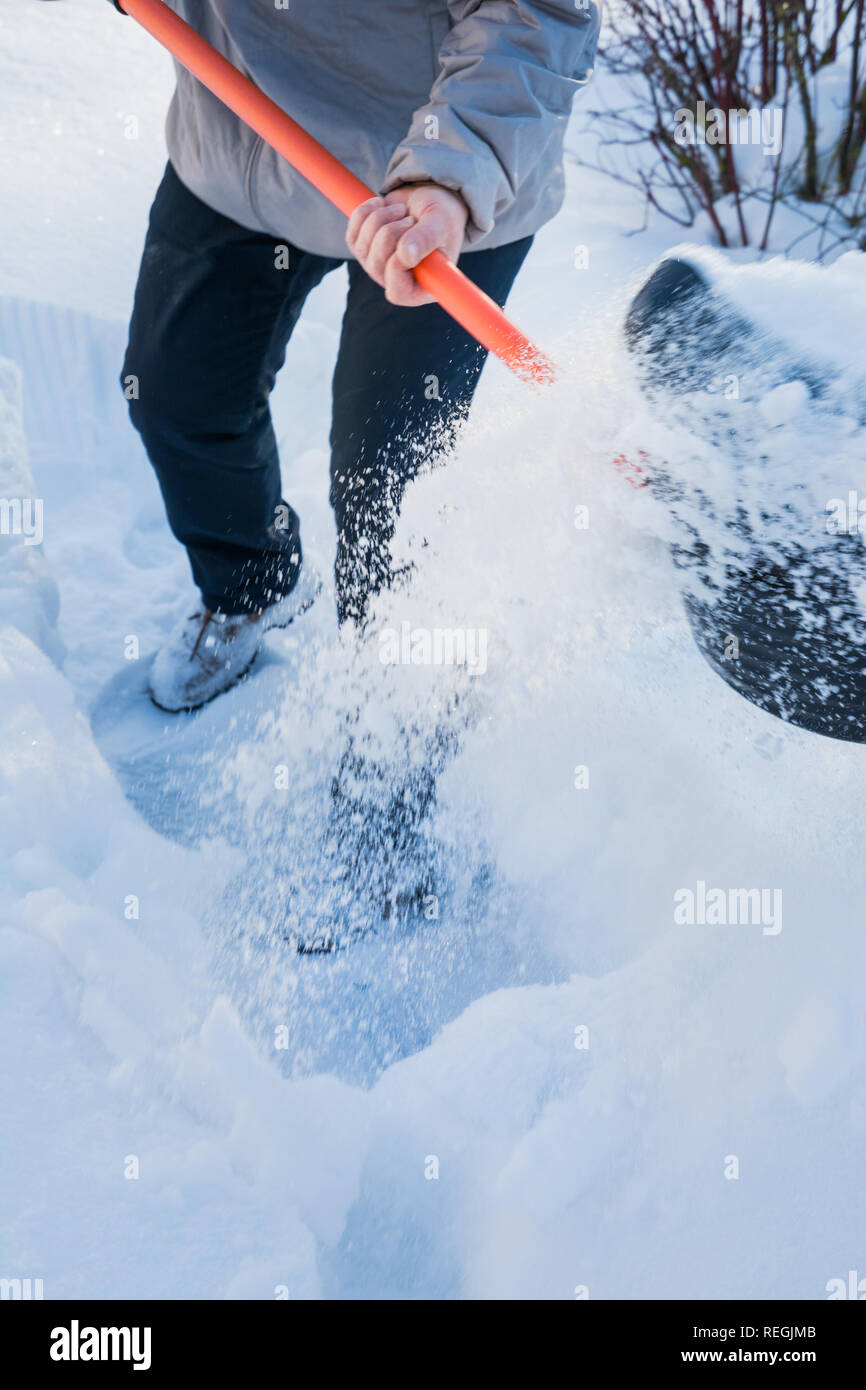 Man clearing sidewalk of snow hi-res stock photography and images - Alamy