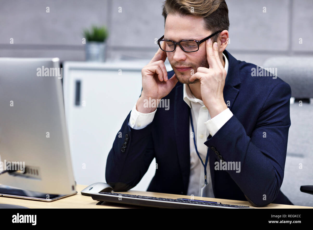 Portrait of businessman at workplace Stock Photo - Alamy