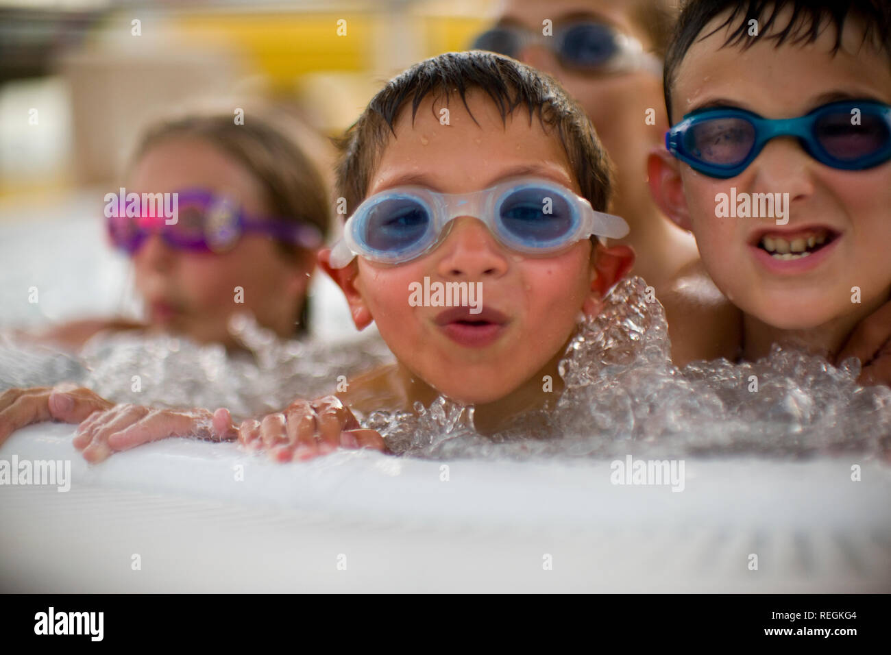 Kids in swimming pool Stock Photo - Alamy