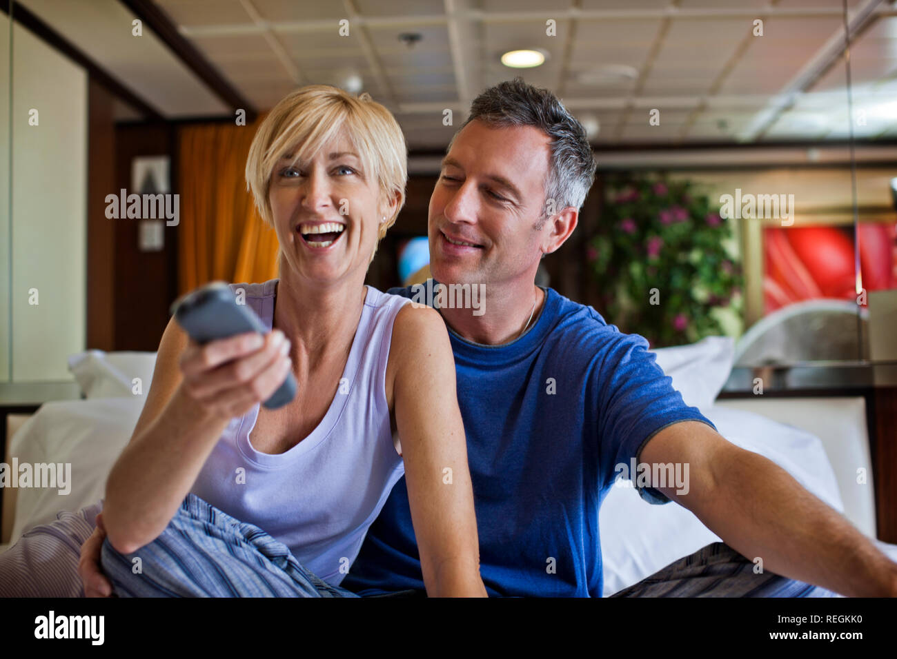 Married couple watches television together Stock Photo - Alamy